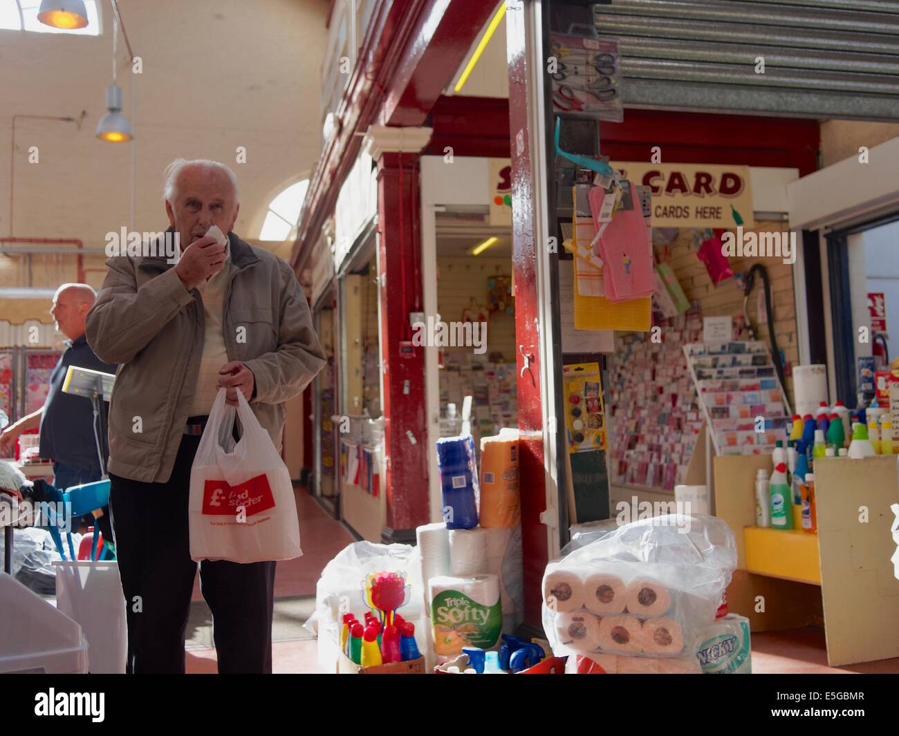 A gentleman waits by the long established stall of all types of ...