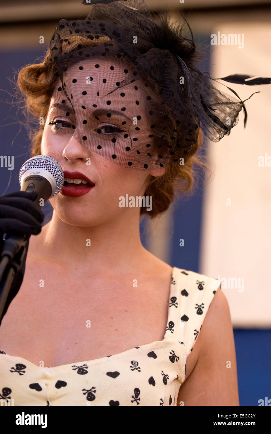 Singer Jeradine Hume in 1940s/50s costume entertaining the crowds at a ...