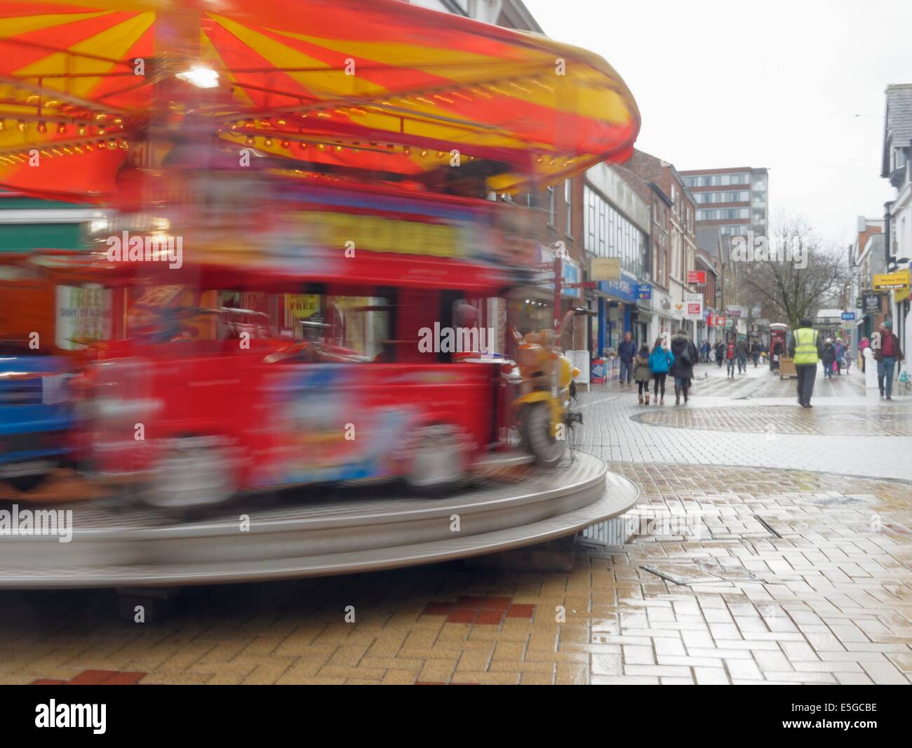 A children's roundabout in the rain Stock Photo - Alamy