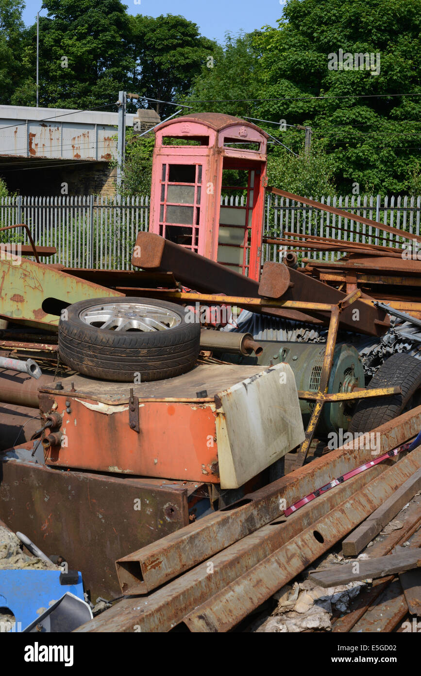 disused red telephone box amongst scrap metal at scrapyard leeds ...