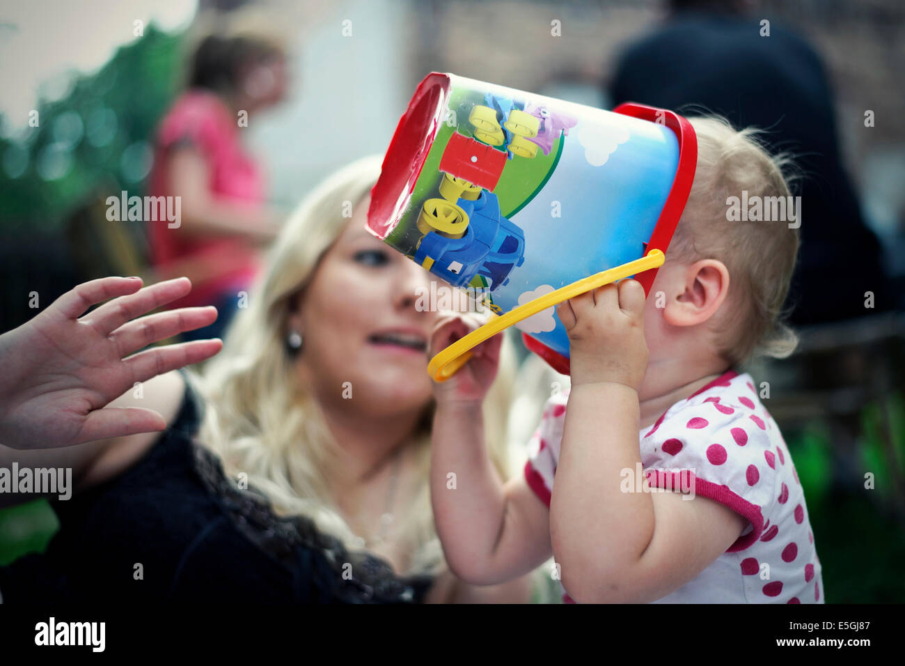 Child bucket on head hi-res stock photography and images - Alamy
