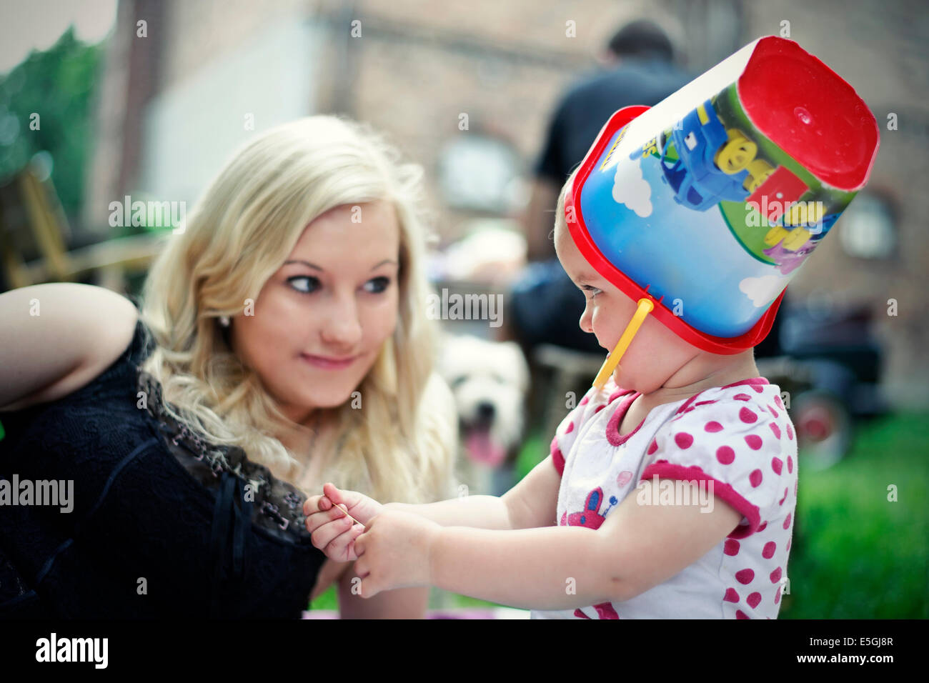 Child bucket on head hi-res stock photography and images - Alamy