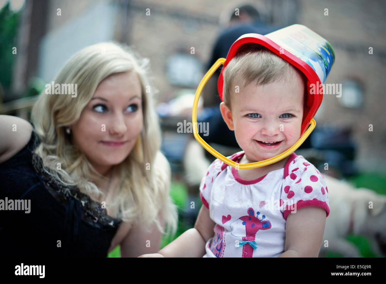 Child bucket on head hi-res stock photography and images - Alamy
