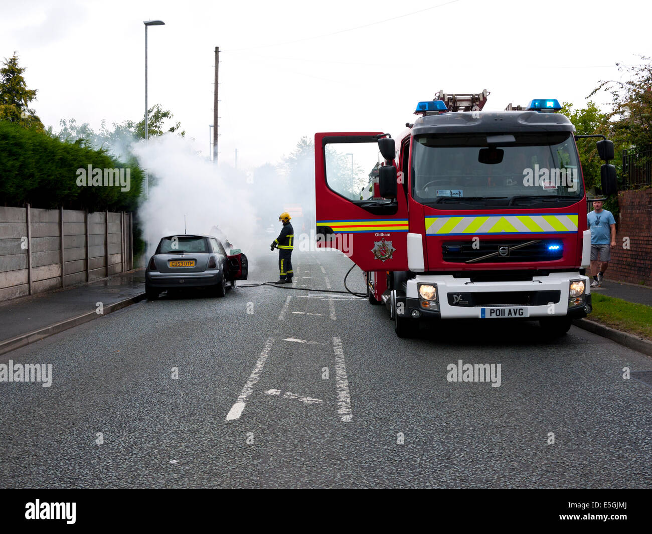 A BMW Mini catches fire and the local fire brigade arrive within ...