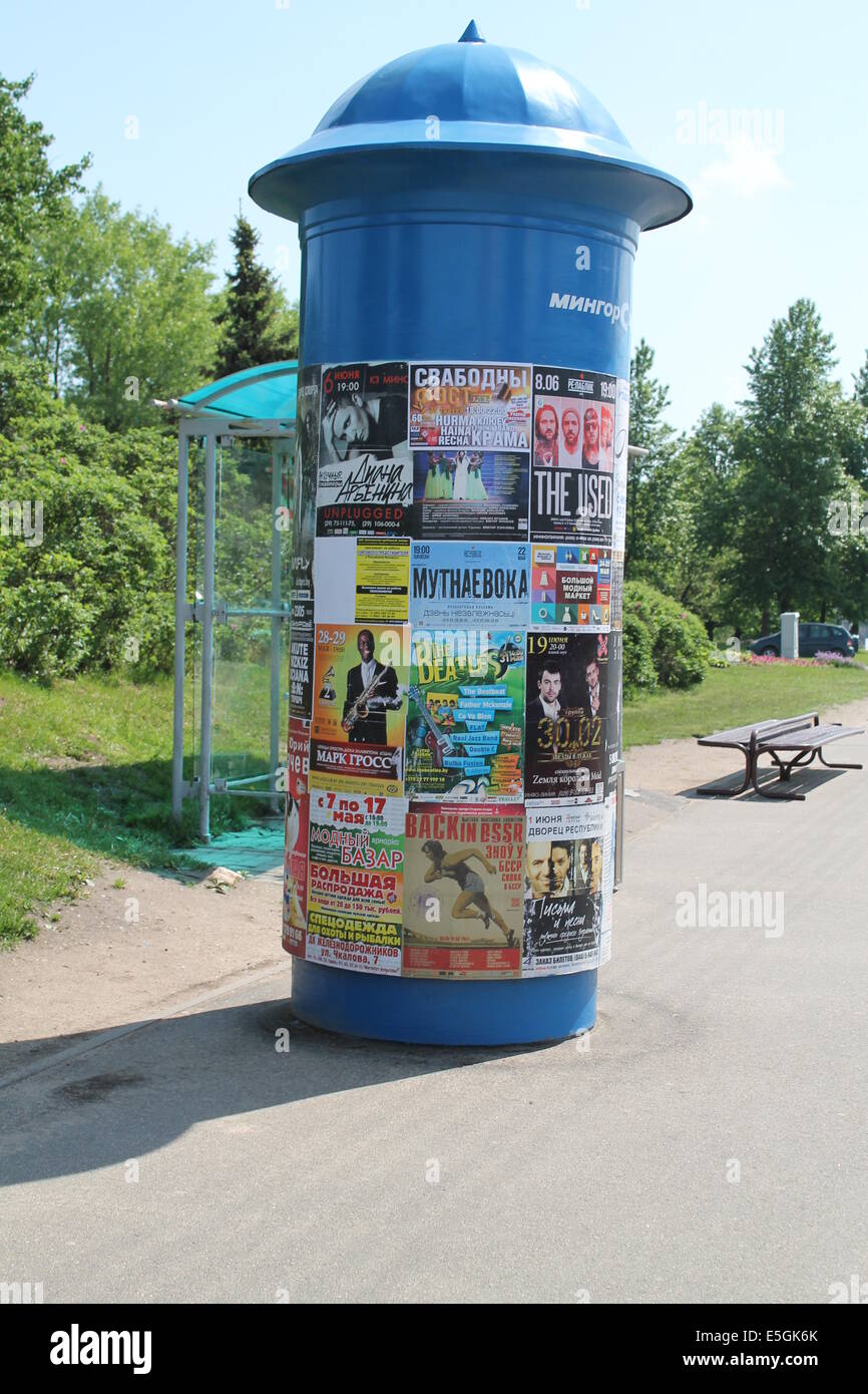 blue pillar with different announce about culture life of the city ...