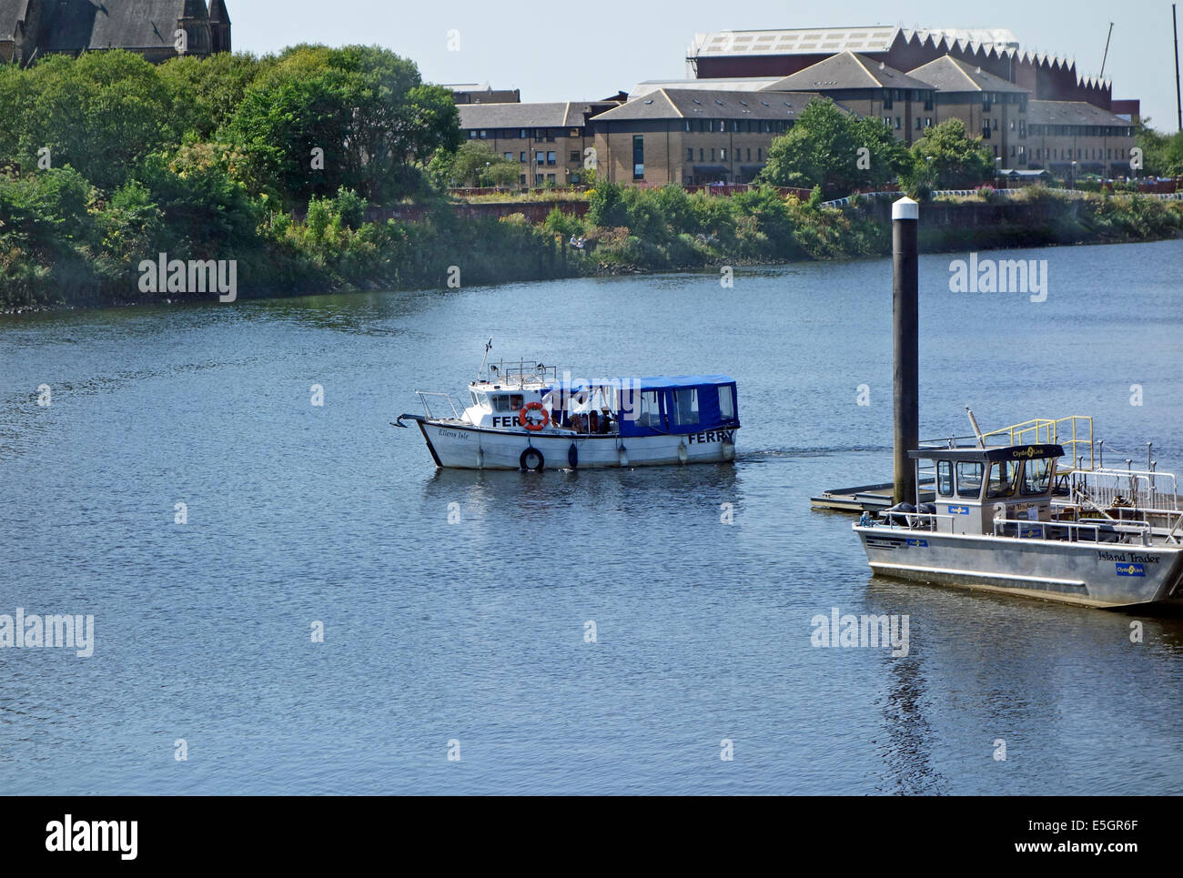The Govan ferry sailing from its berth at the Riverside Museum across ...