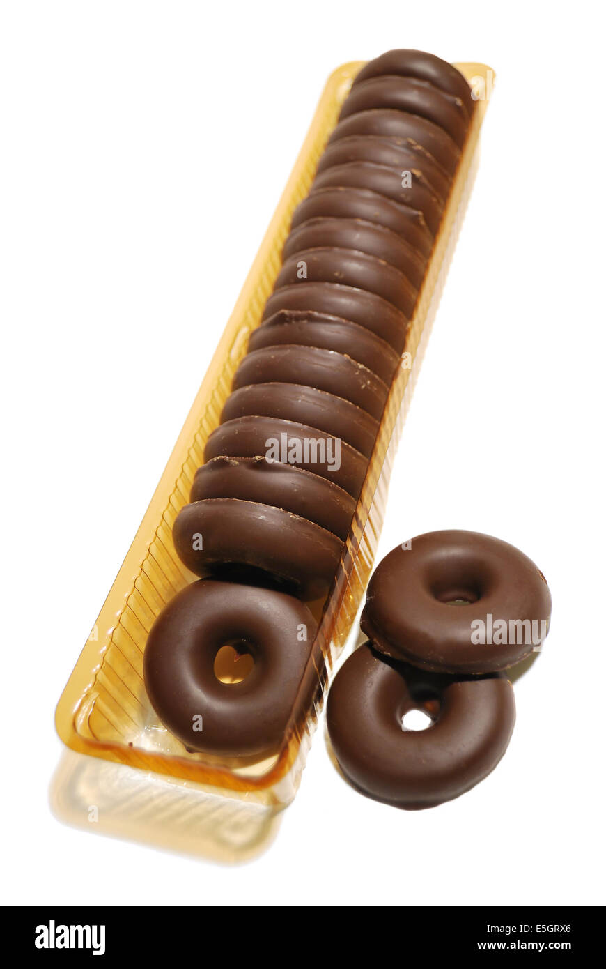 Chocolate cookie rings in open pack on white background Stock Photo - Alamy