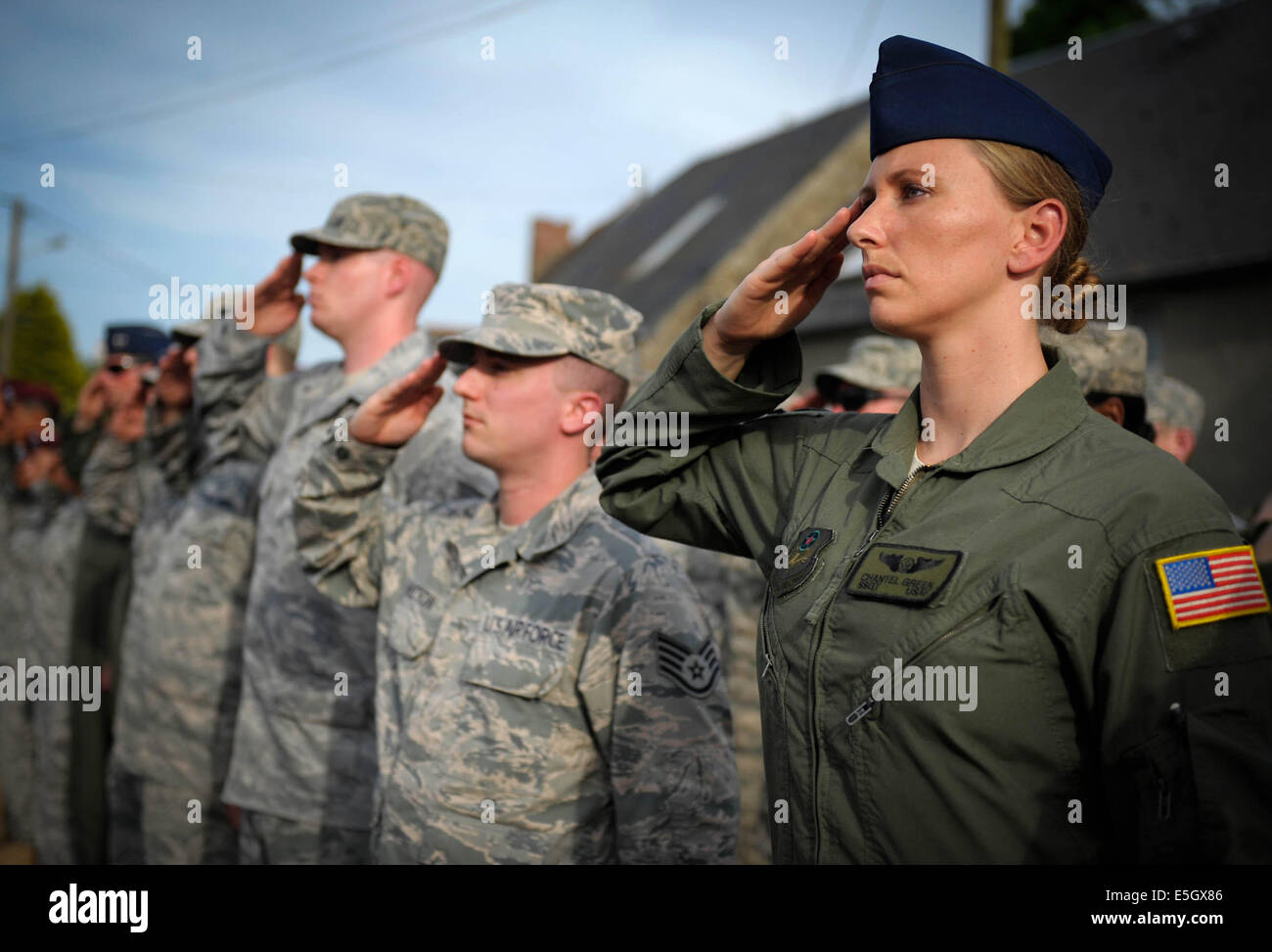 U.S. Airmen salute as the national anthems of the U.S. and France are ...