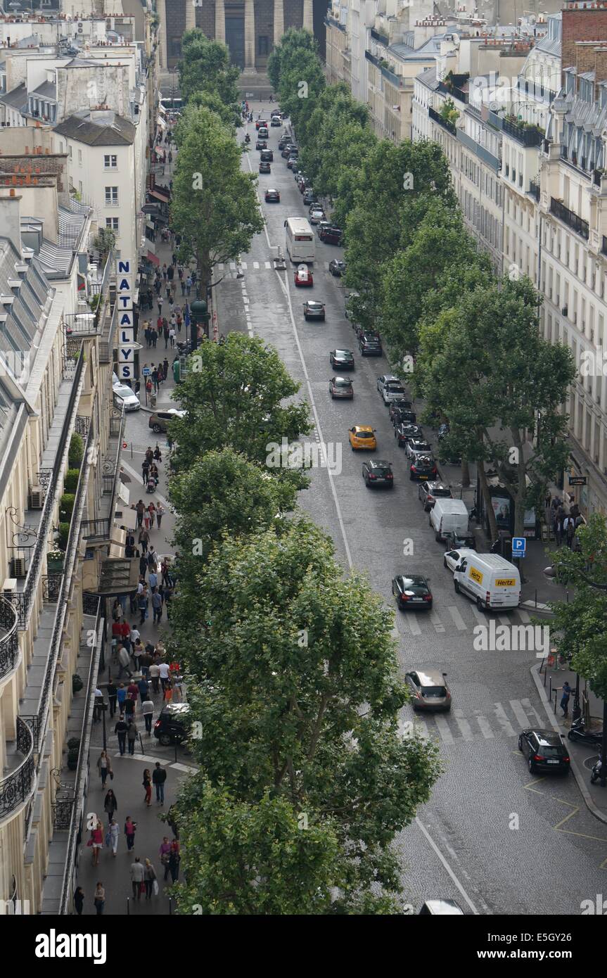 Overhead, panoramic view of Paris street, pedestrians, cars, trees ...