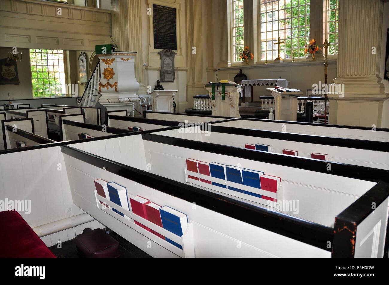 PHILADELPHIA, PENNSYLVANIA: White boxed pews with red and blue prayer ...