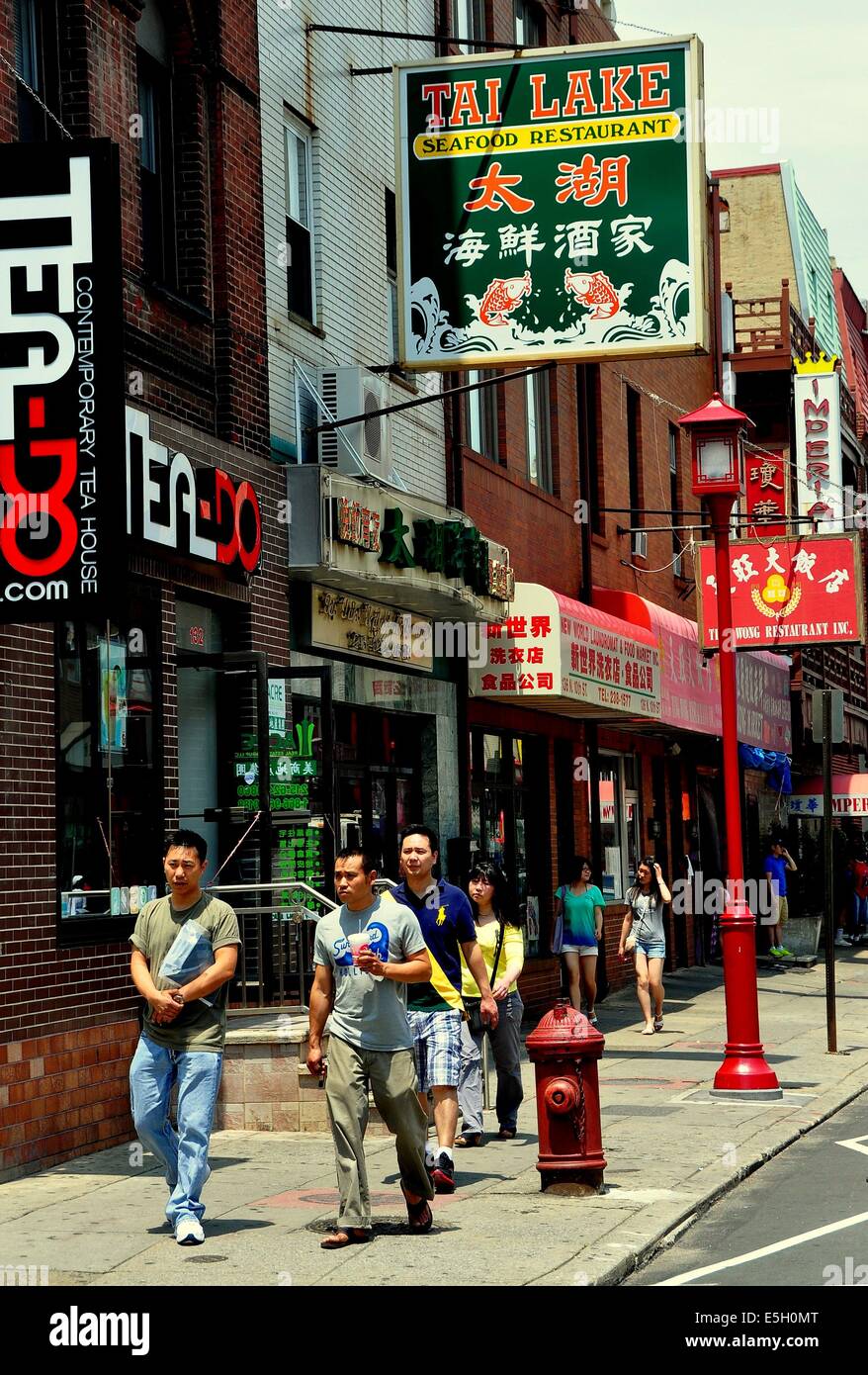 PHILADELPHIA, PENNSYLVANIA: Storefront signs in Chinese hang from ...