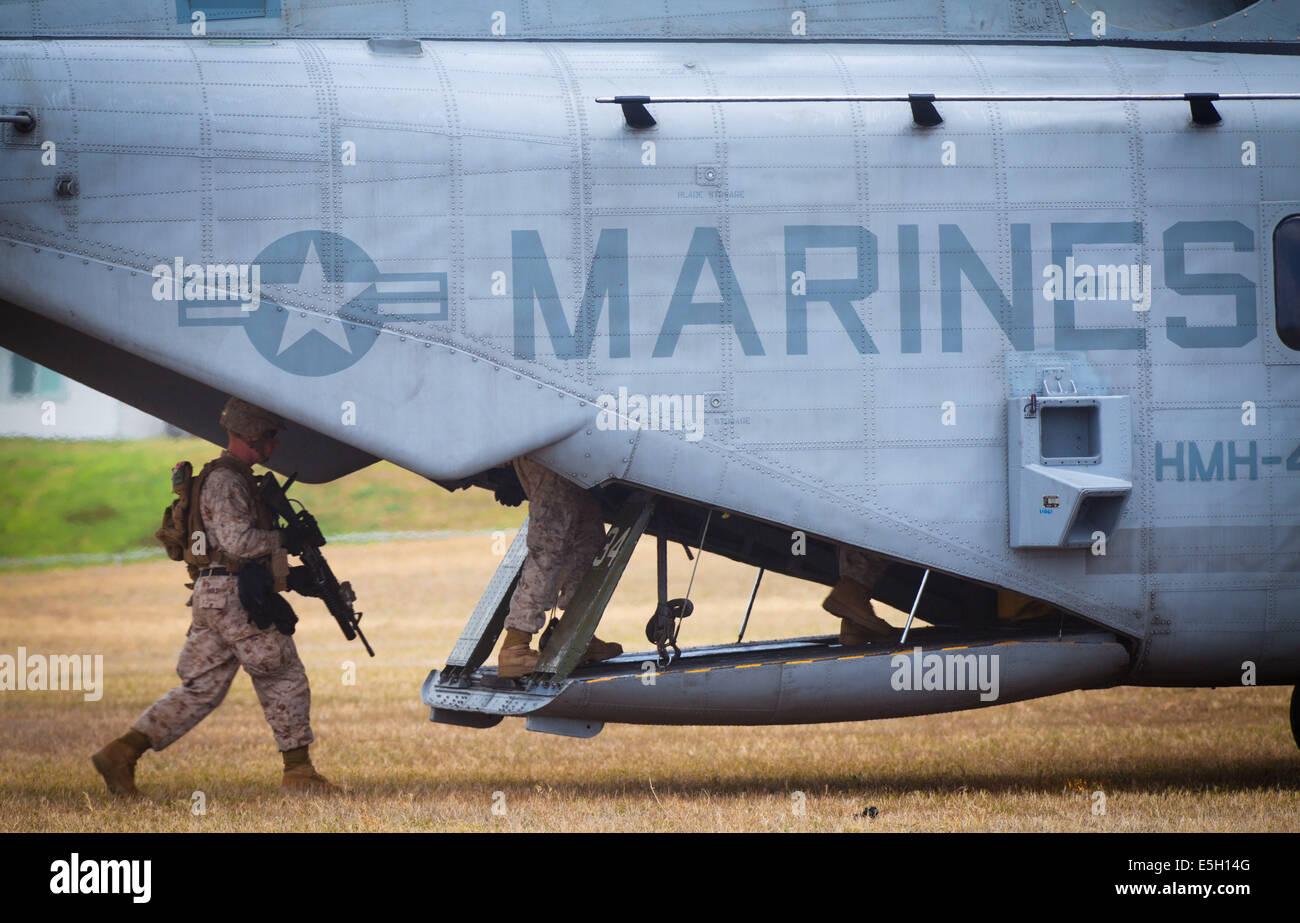 U.S. Marines with the 3rd Battalion, 3rd Marine Regiment board a CH-53E ...