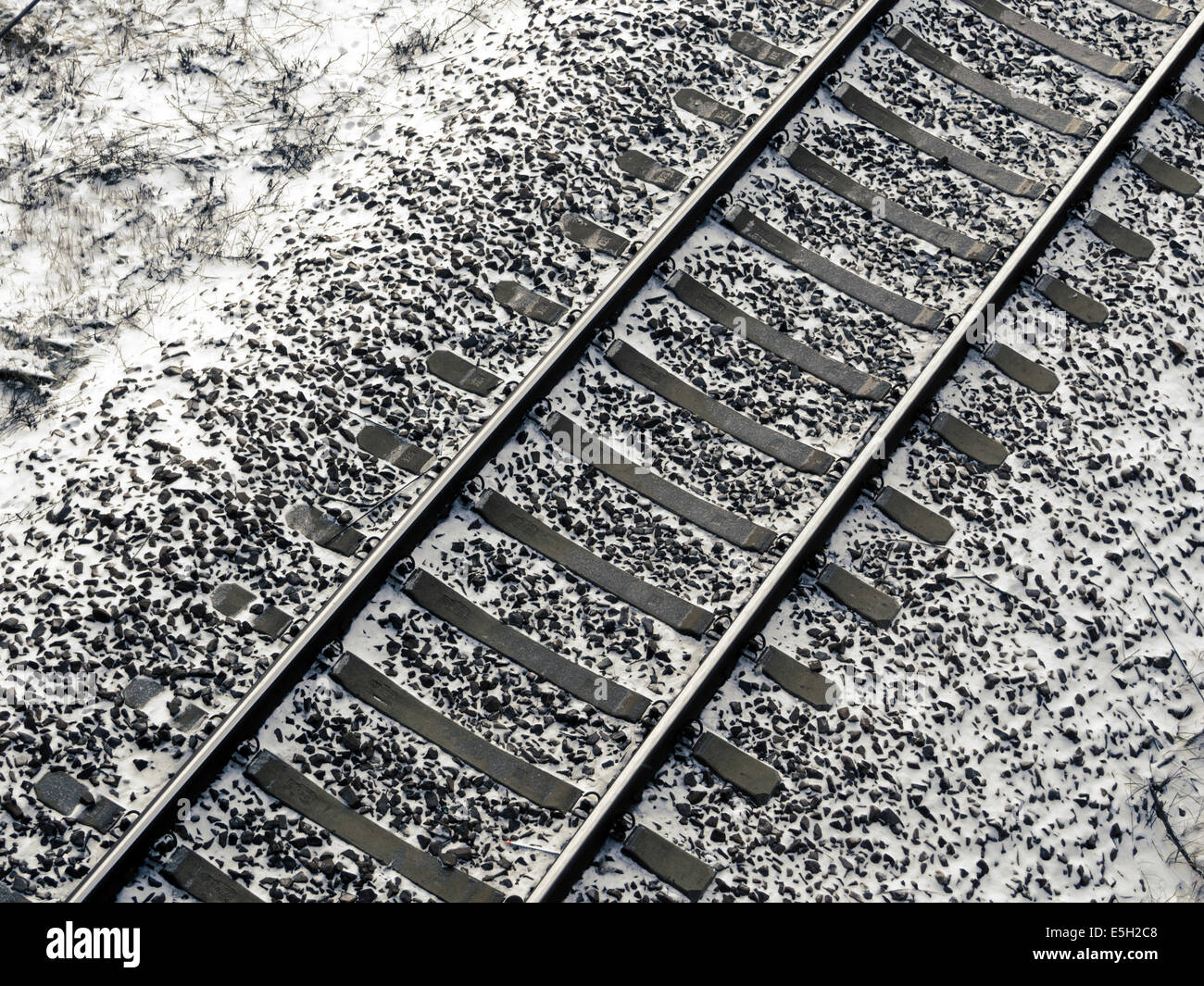 top view of railway track fragment covered by fresh snow Stock Photo ...