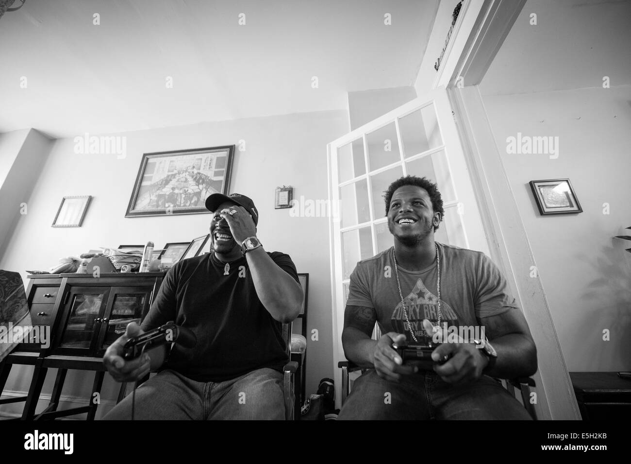 Steve Morris (left) and his son Stephon Morris joke and laugh playing ...
