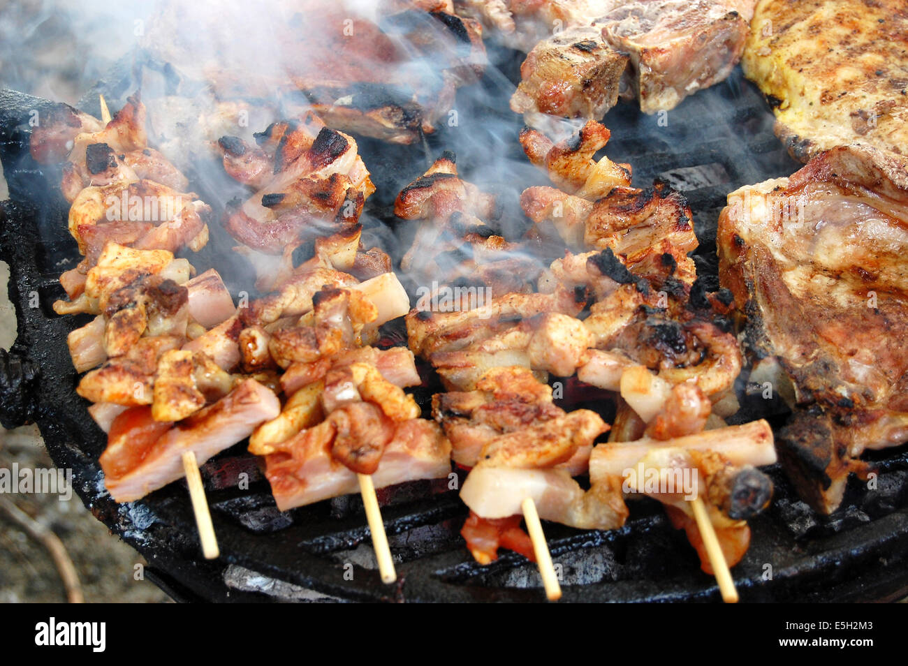Grilled meat, prepared for a family lunch Stock Photo - Alamy