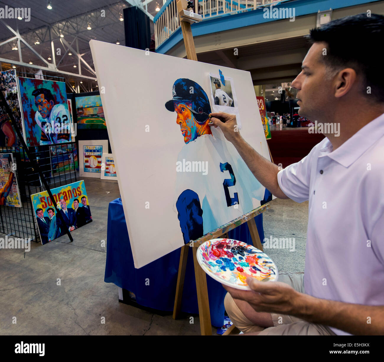 Cleveland, Ohio, USA. 31st July, 2014. Artist AL SORENSON paints a ...