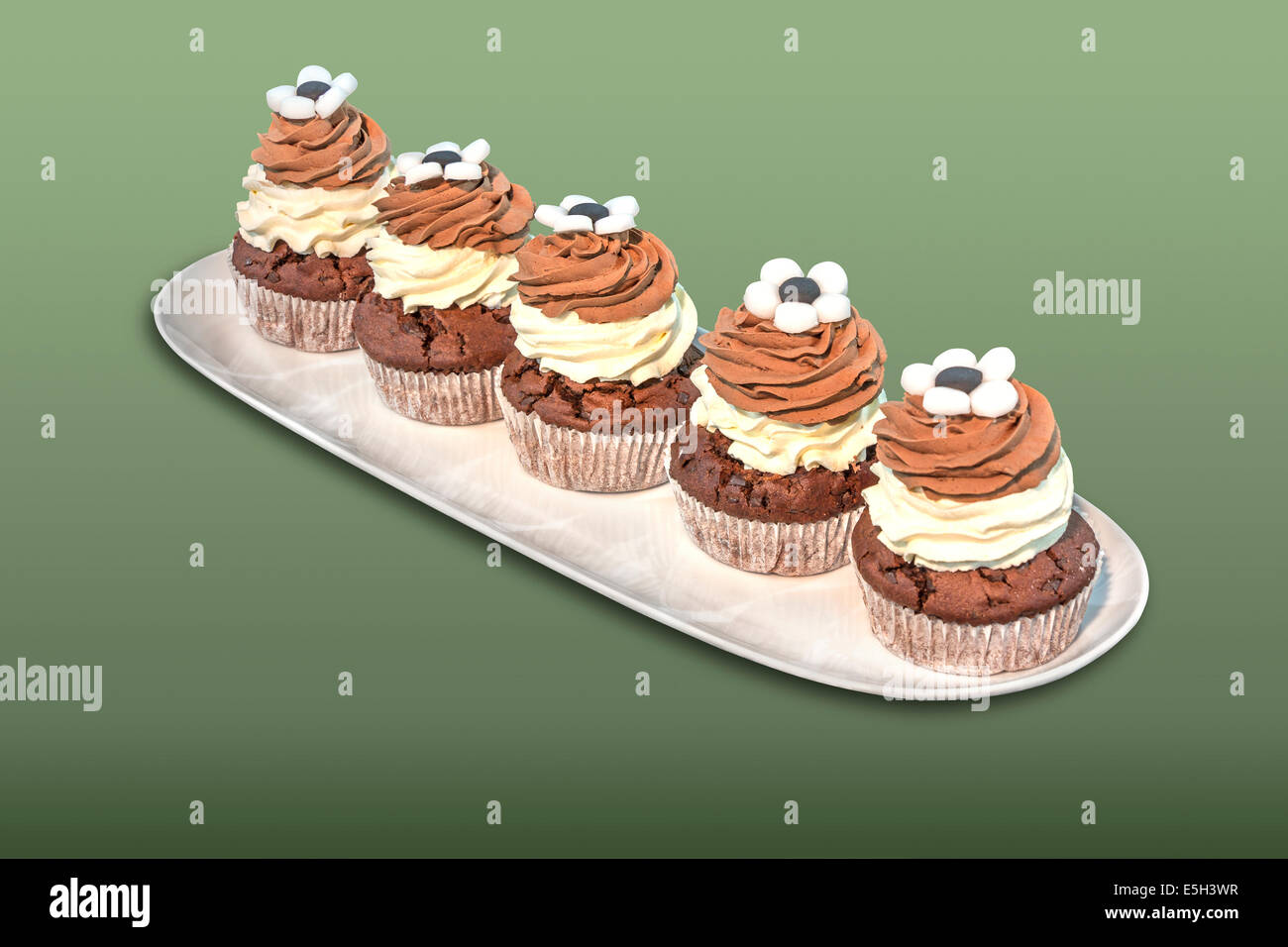 Sweet bran muffins on a plate and green background Stock Photo - Alamy