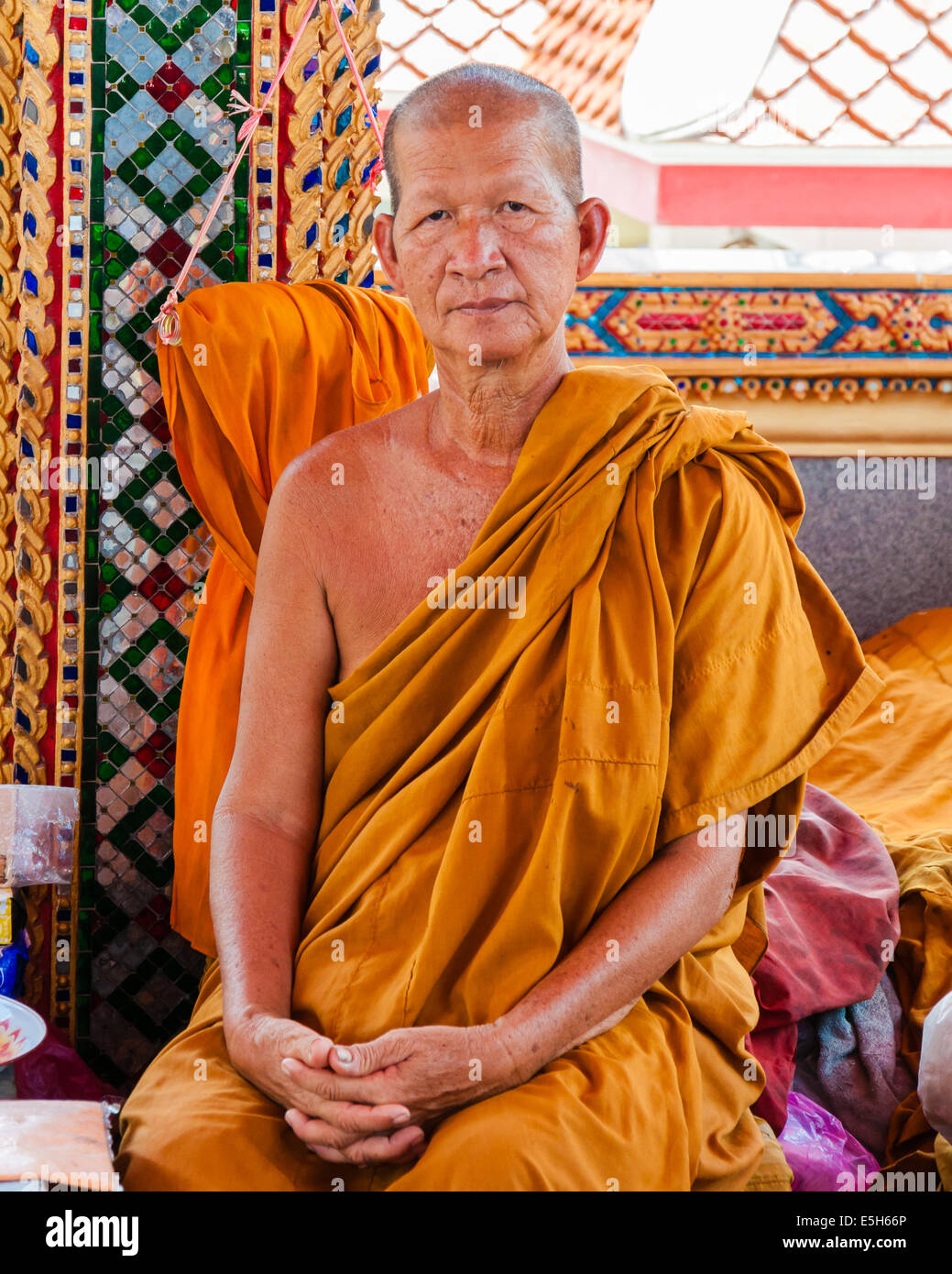 Buddhist monk poses for a photo at buddhist temple from Damnoen Saduak ...
