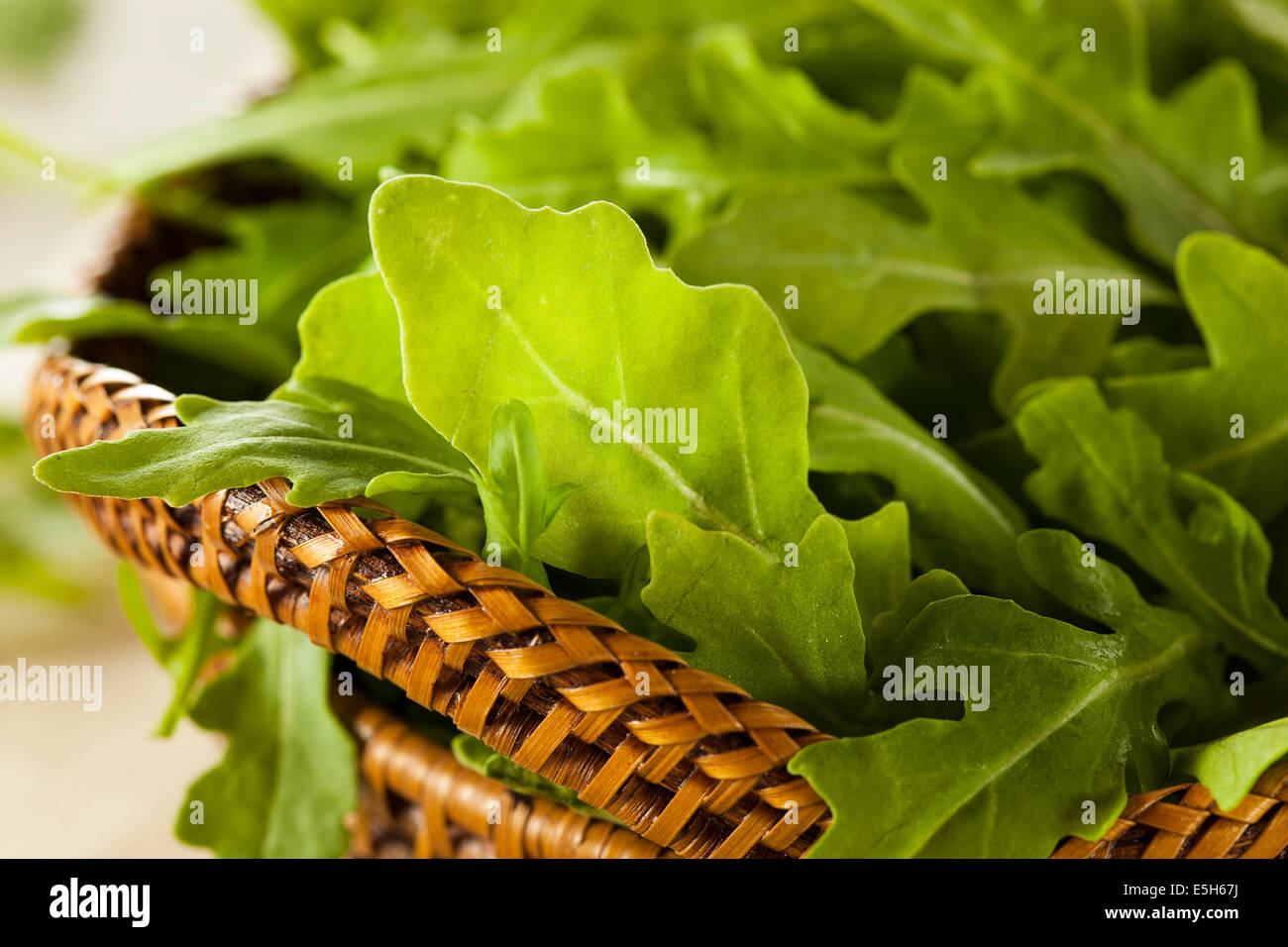 Organic Raw Green Arugula in a Basket Stock Photo - Alamy