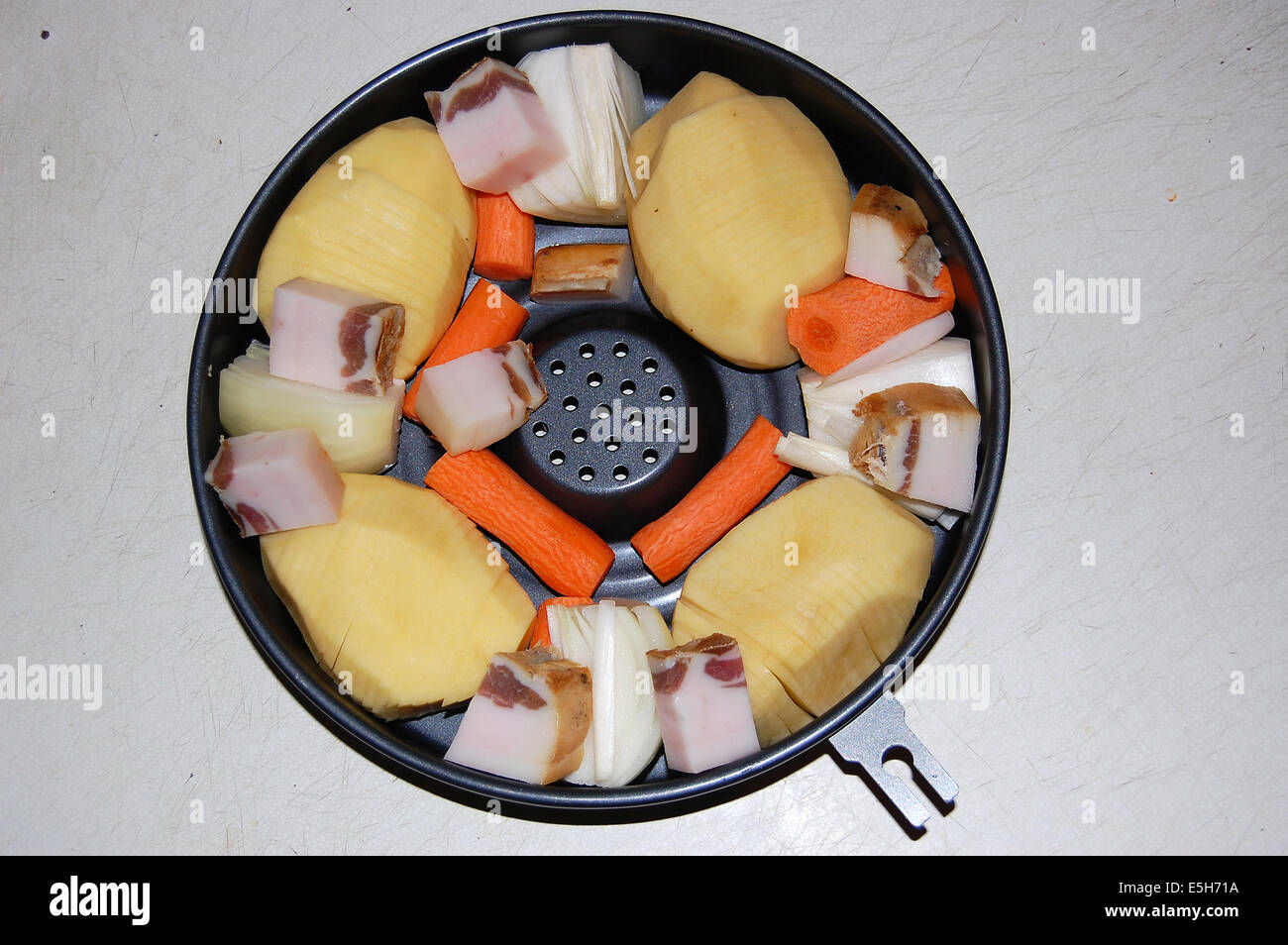 vegetables prepared for cooking in the dry cooker Stock Photo - Alamy