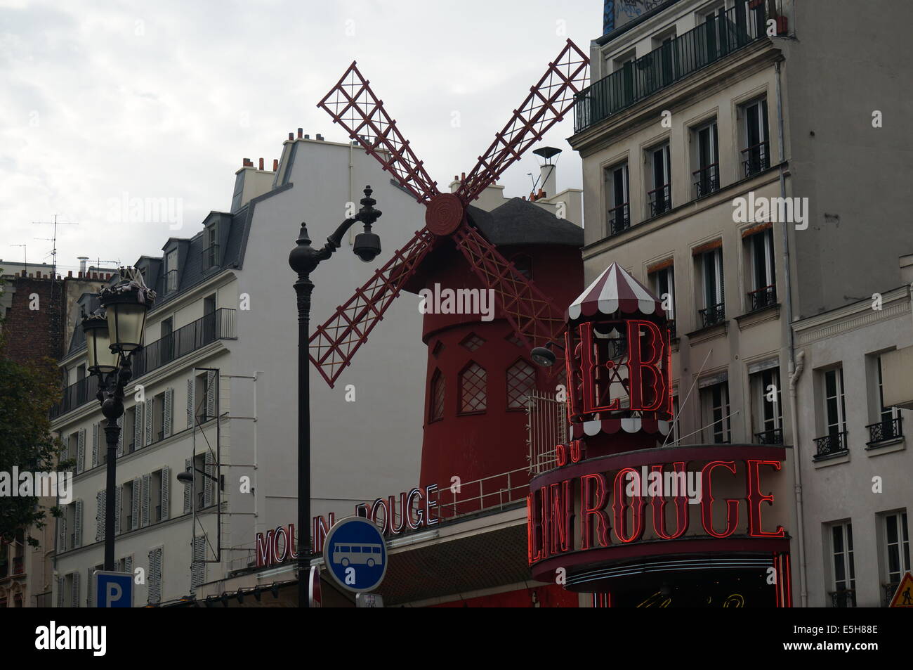 Moulin Rouge marked by the red windmill on its roof among Paris ...