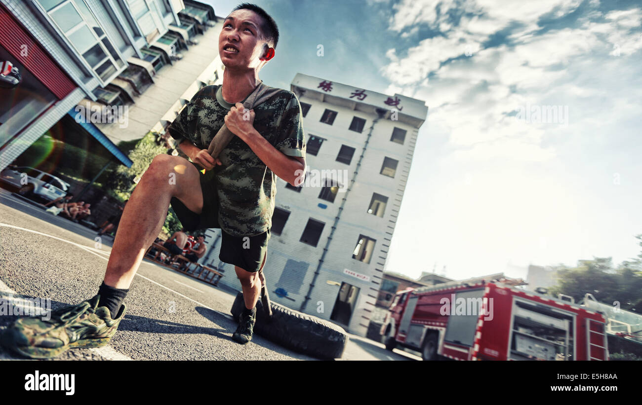 Chongqing, China. 23rd June, 2013. Firefighter Chen Jihang, a ...