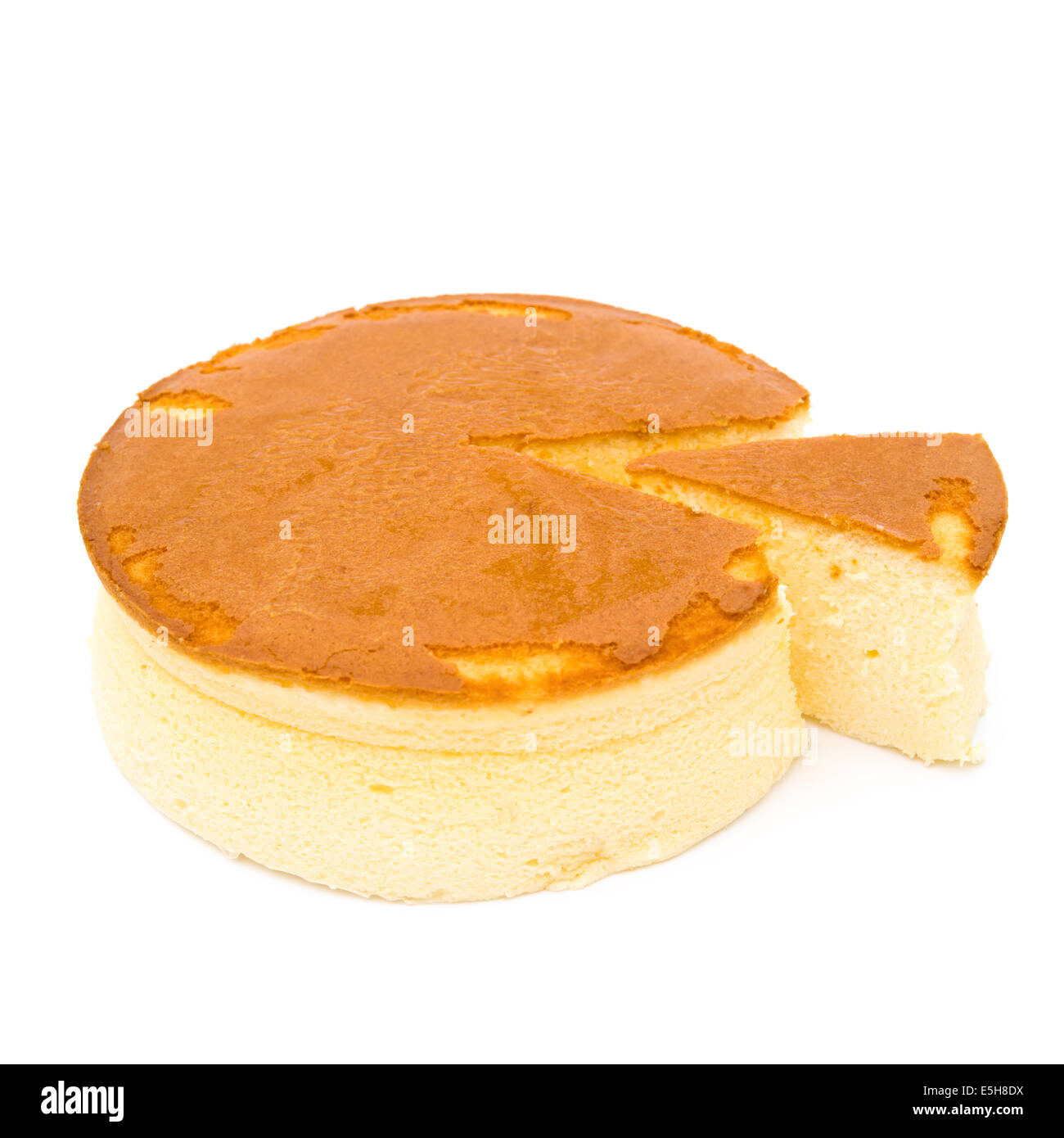 side view round cheese cake with one piece cut out on white Stock Photo ...