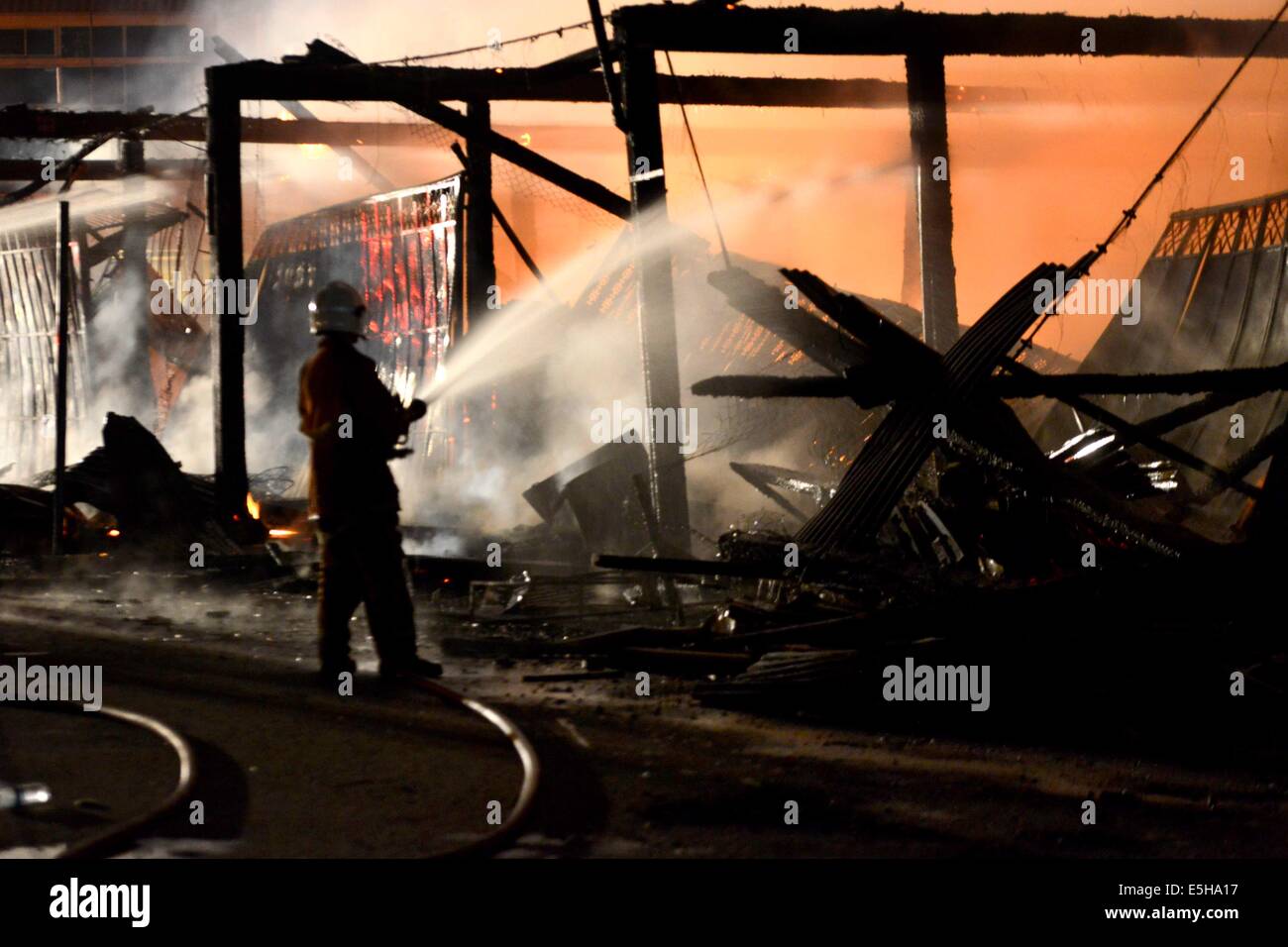 Kuala Lumpur, Malaysia. 1st Aug, 2014. A fire fighter tries to ...