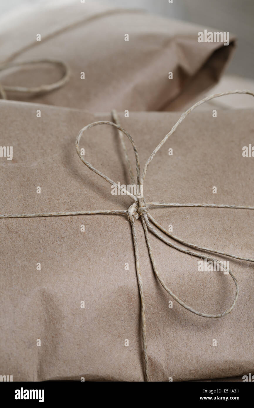 vintage style parcels wrapped with rope, close up photo Stock Photo - Alamy