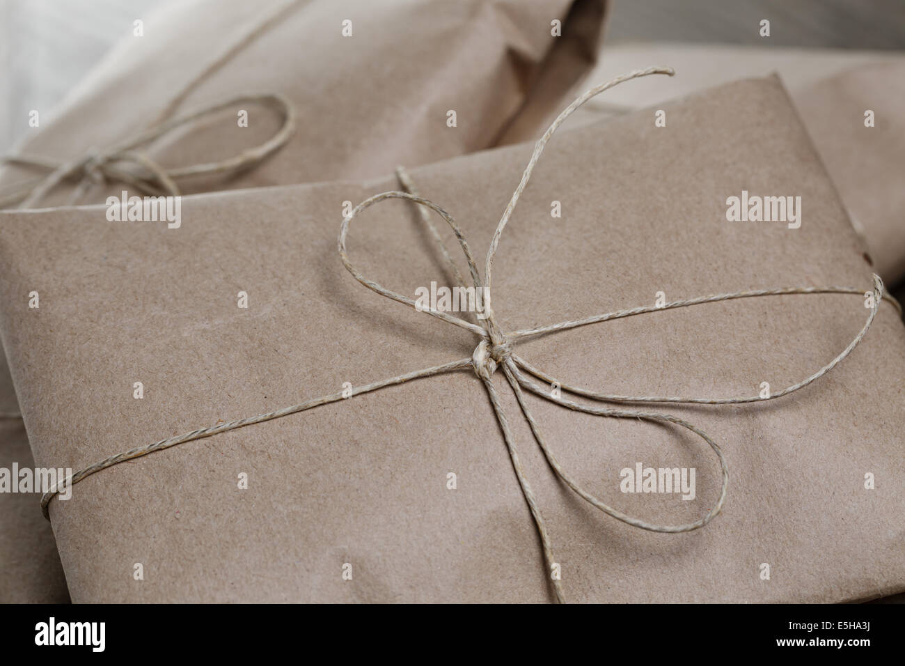 vintage style parcels wrapped with rope, close up photo Stock Photo - Alamy