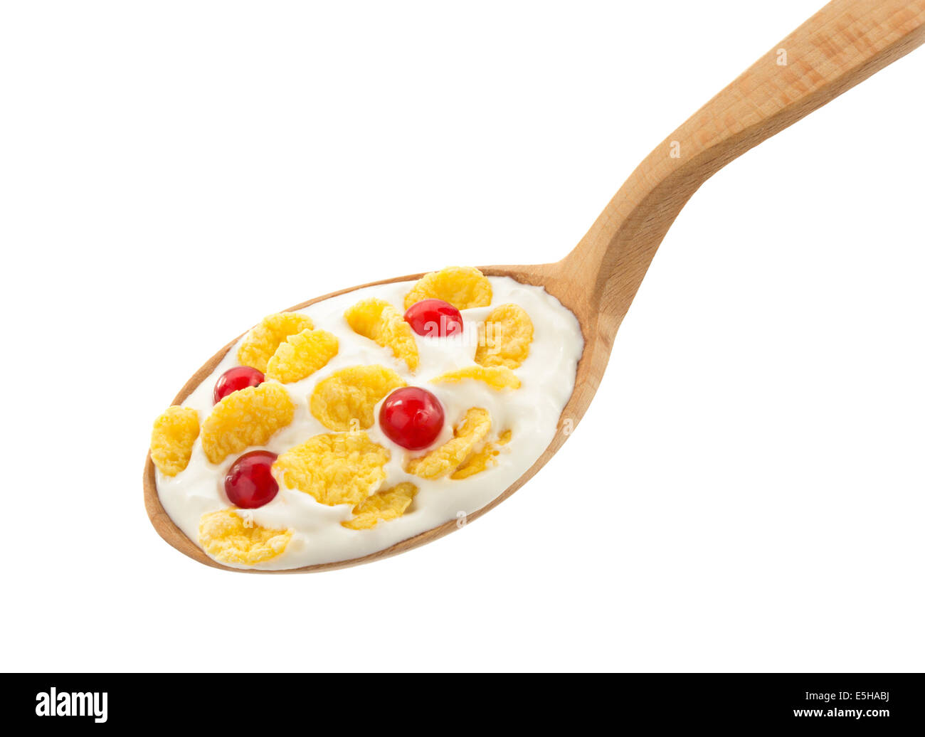 corn flakes in spoon isolated on white background Stock Photo - Alamy