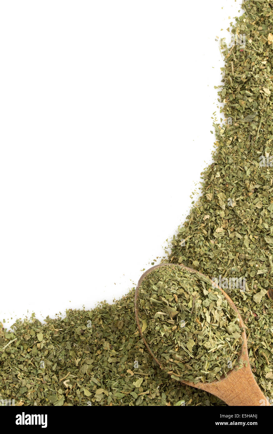 dried green spices in spoon isolated on white background Stock Photo ...