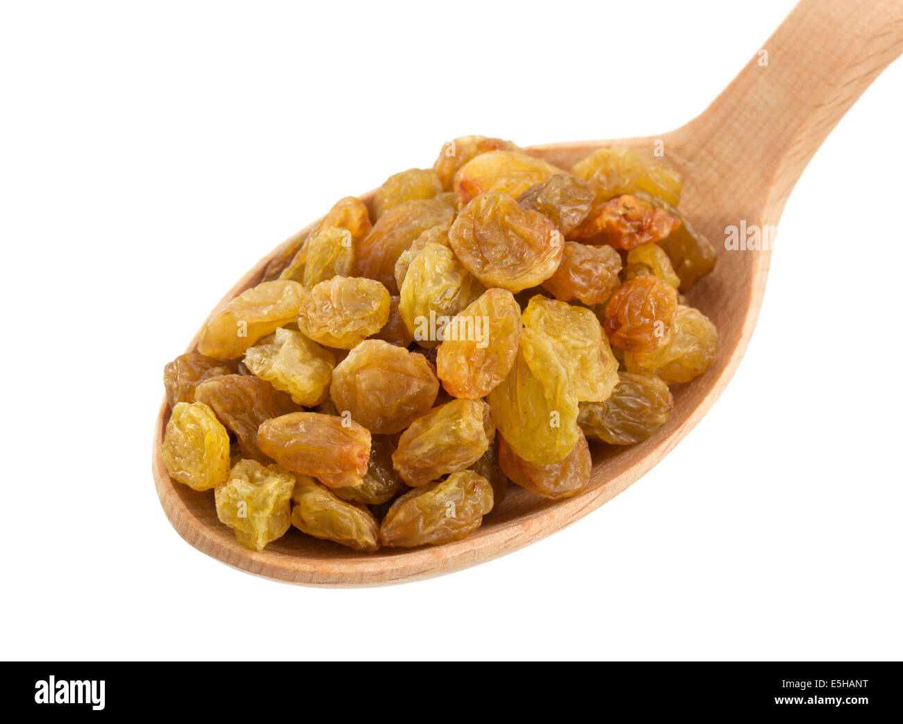 raisins fruit in spoon on white background Stock Photo - Alamy