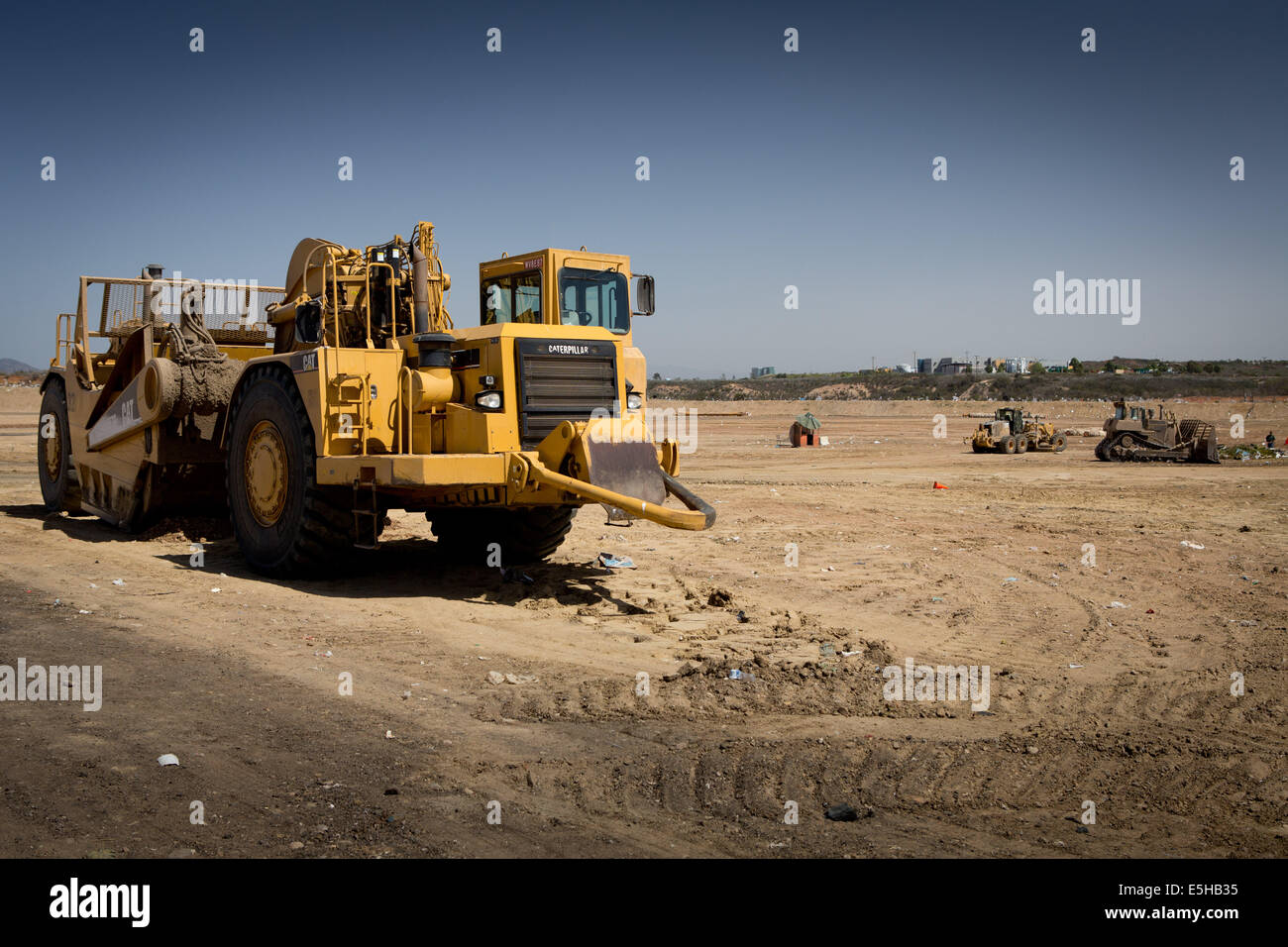 A Caterpillar 657G open bowl scraper at a landfill. Almost 910,000 tons of waste are disposed ...