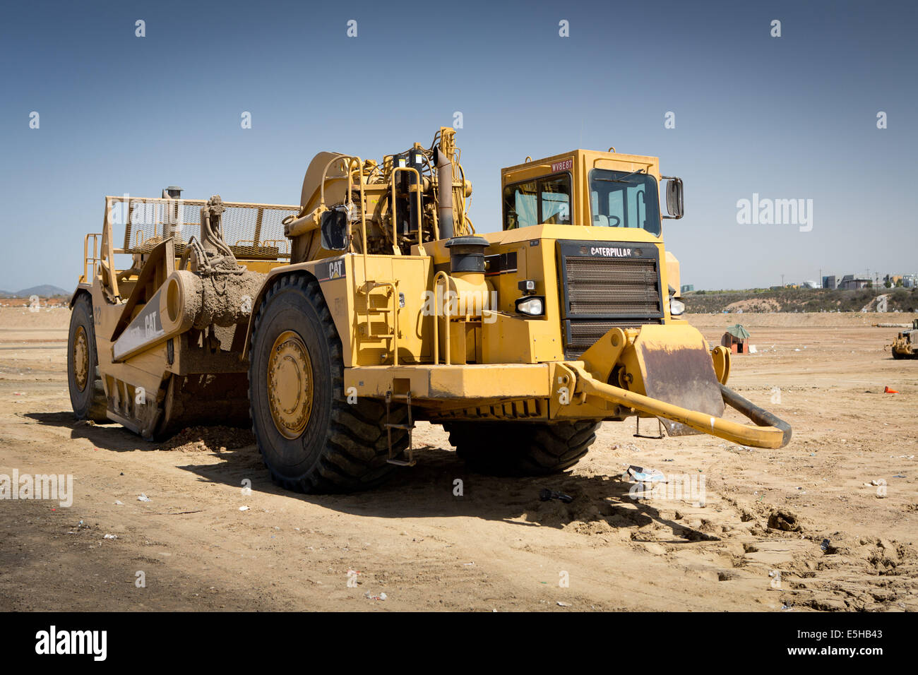 A Caterpillar 657G open bowl scraper at a landfill. Almost 910,000 tons of waste are disposed ...