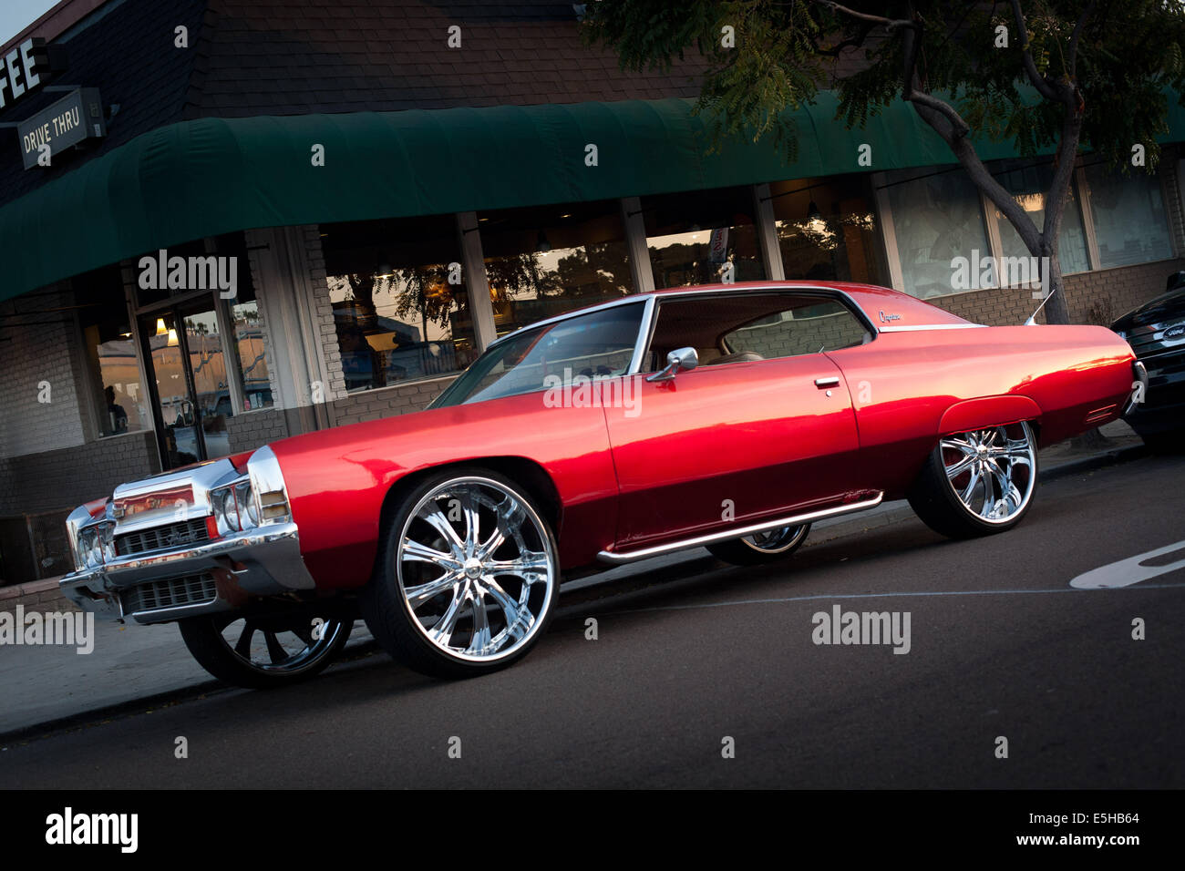 Chevrolet Caprice with chrome-plated star rims, parked in front of a ...