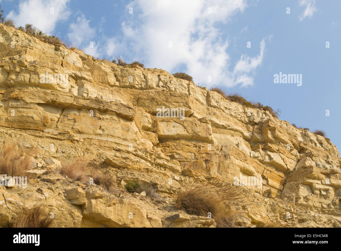 Low angle take of a huge limestone cliff Stock Photo - Alamy