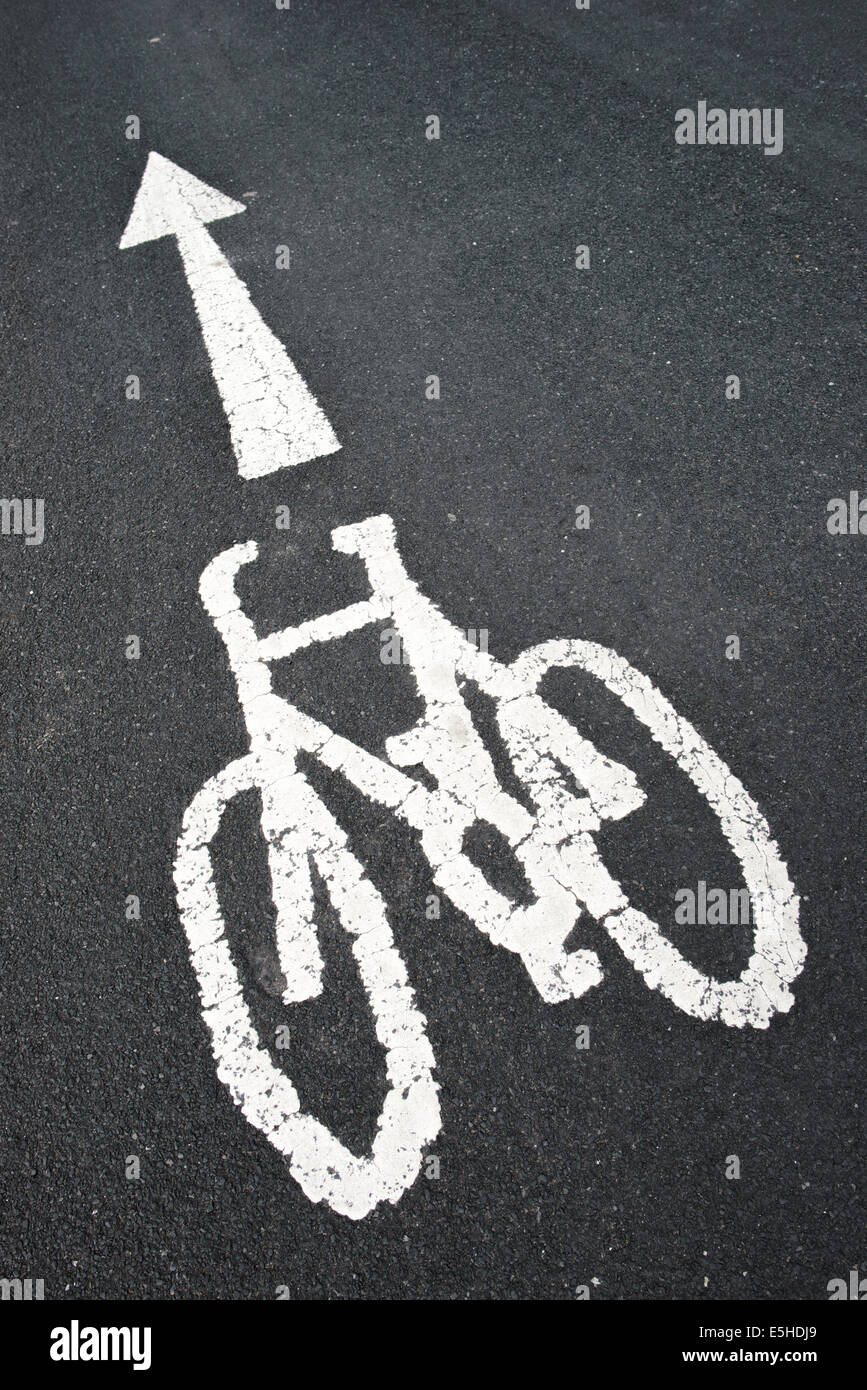 Painted sign on a road showing the route of a cycle path Stock Photo ...