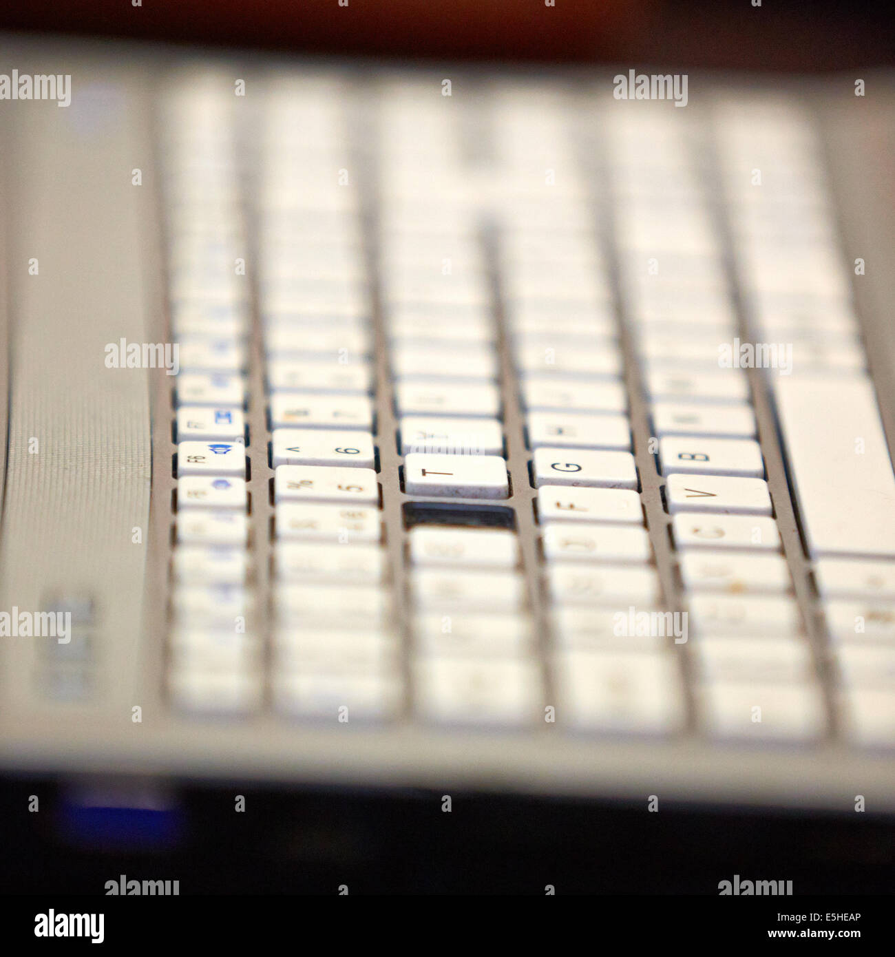 White keyboard with a single key missing (shallow depth of field Stock ...