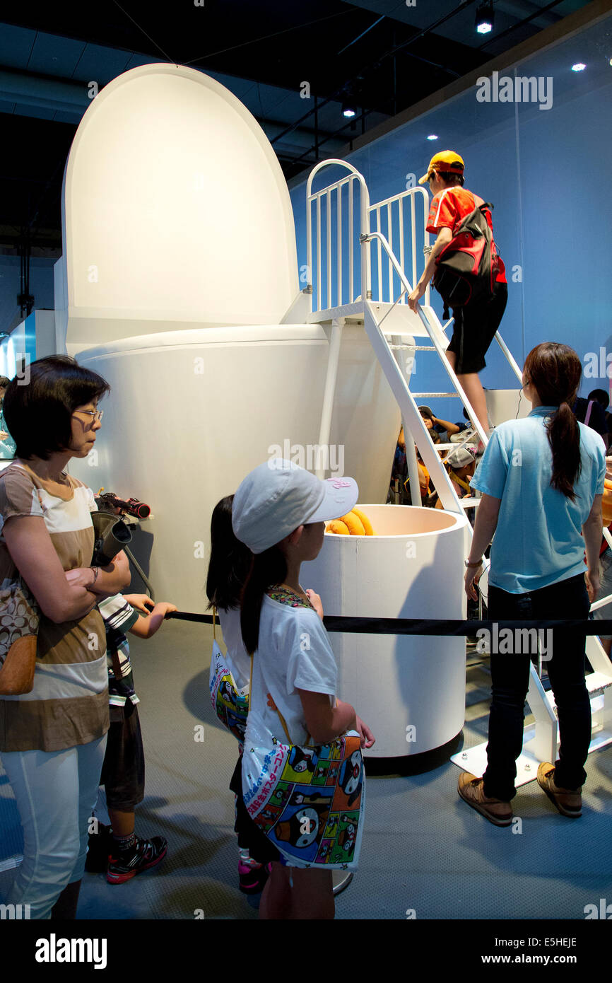 Tokyo, Japan. 1st August, 2014. A boy slides down the giant toilet at ...