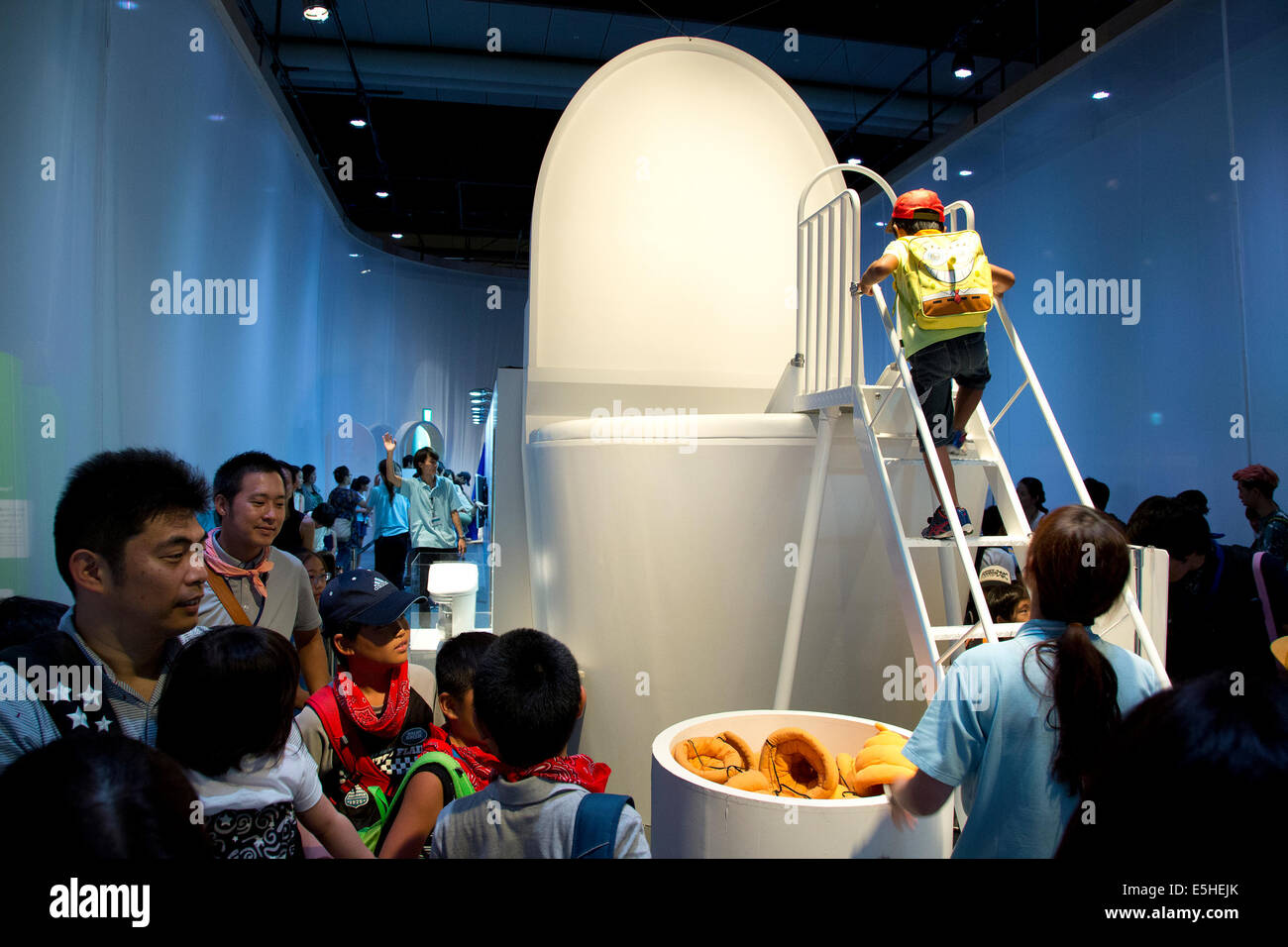 Tokyo, Japan. 1st August, 2014. A boy slides down the giant toilet at ...