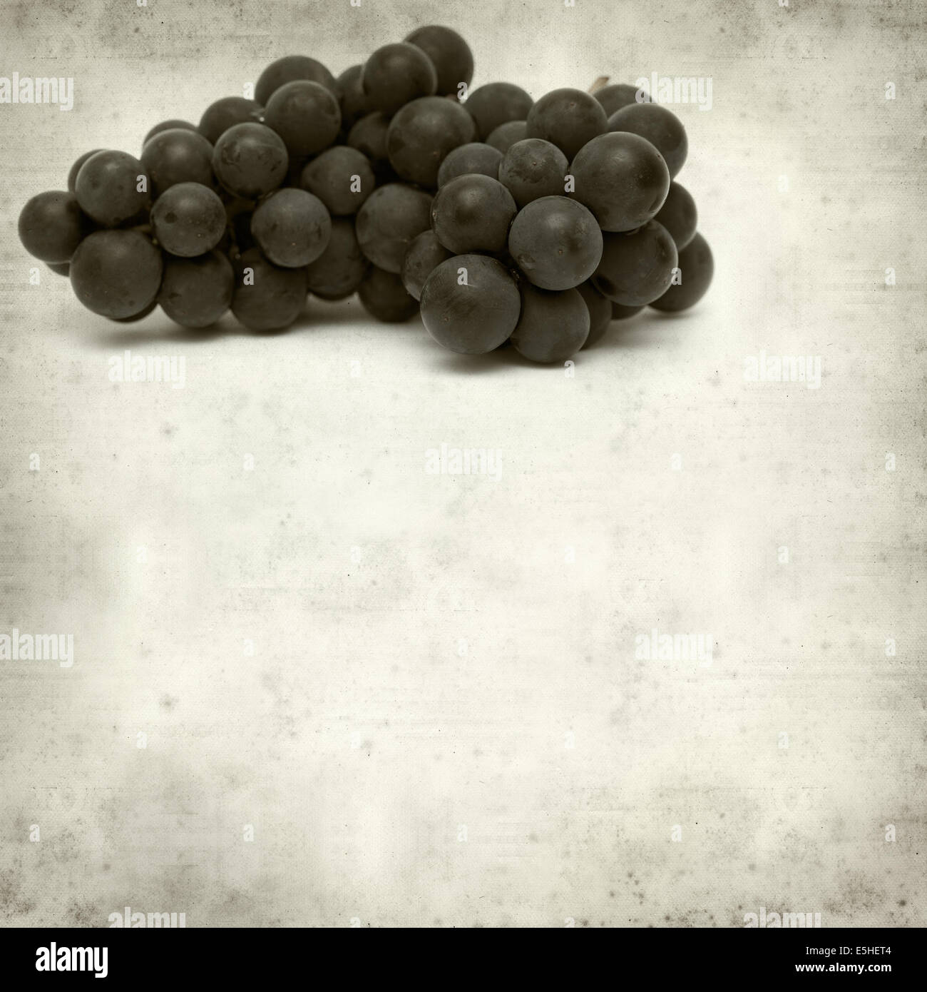 textured old paper background with black grapes Stock Photo - Alamy