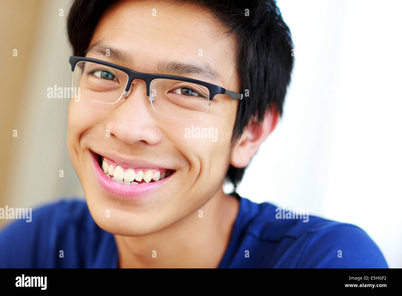Closeup portrait of a smiling asian man Stock Photo - Alamy
