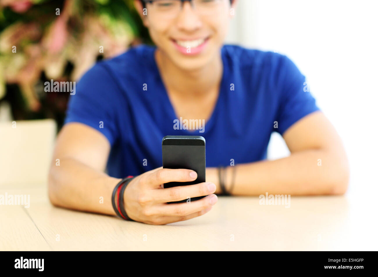 Closeup portrait of a man using smartphone. Focus on smartphone Stock ...