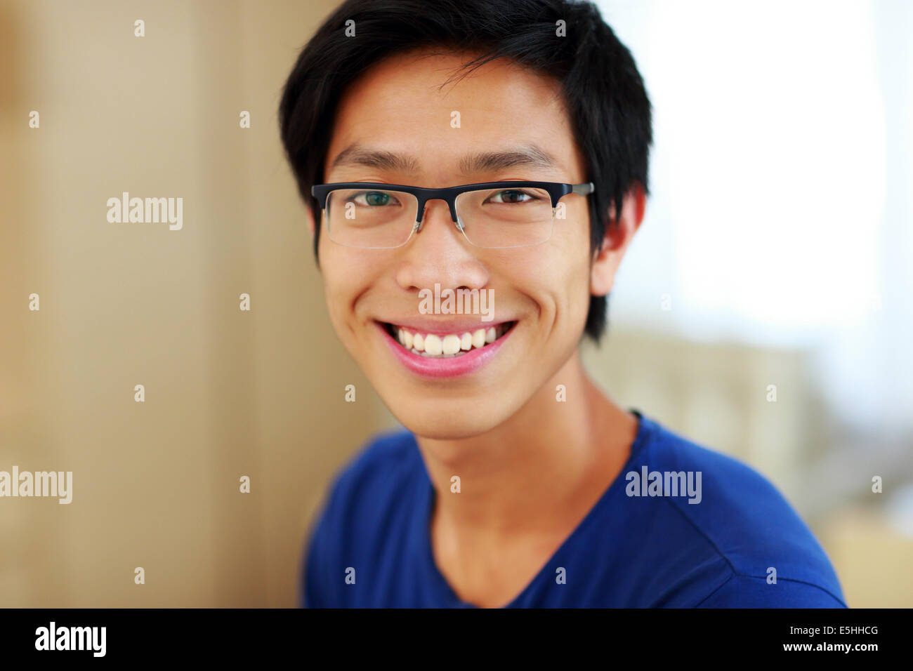 Closeup portrait of a smiling asian man Stock Photo - Alamy