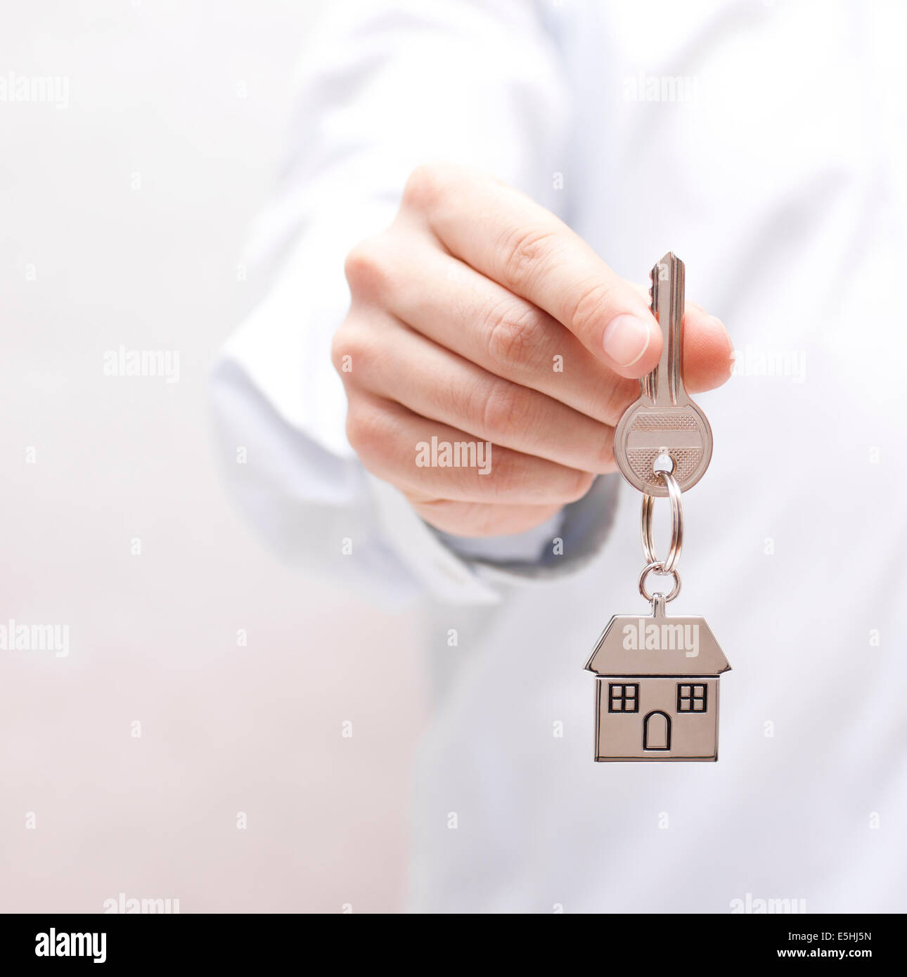 House key in hand Stock Photo - Alamy