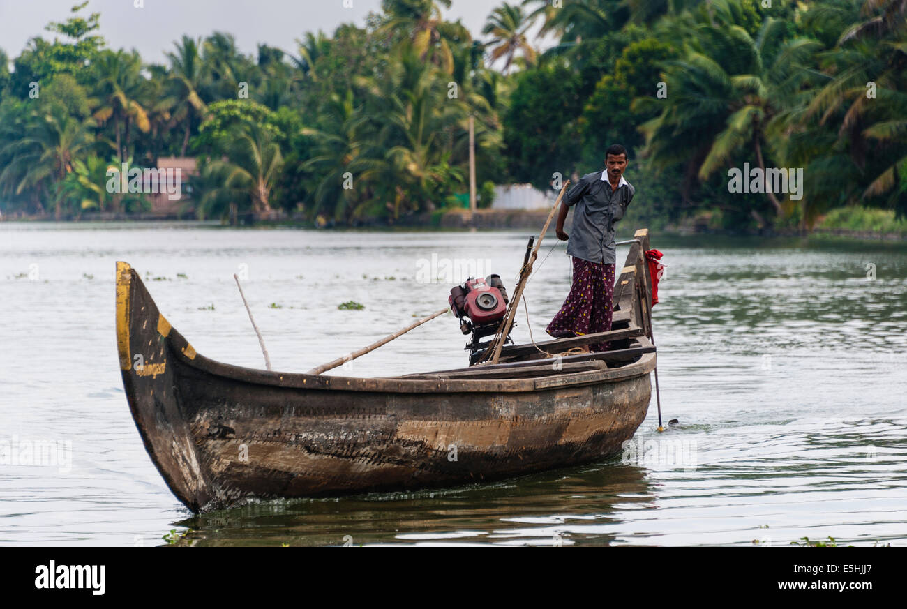 Indian man steering a boat, Backwaters, Alappuzha District, Alleppey ...