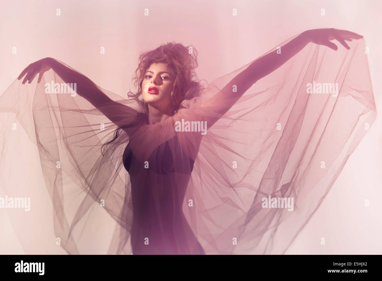 Young woman with wing veil Stock Photo - Alamy