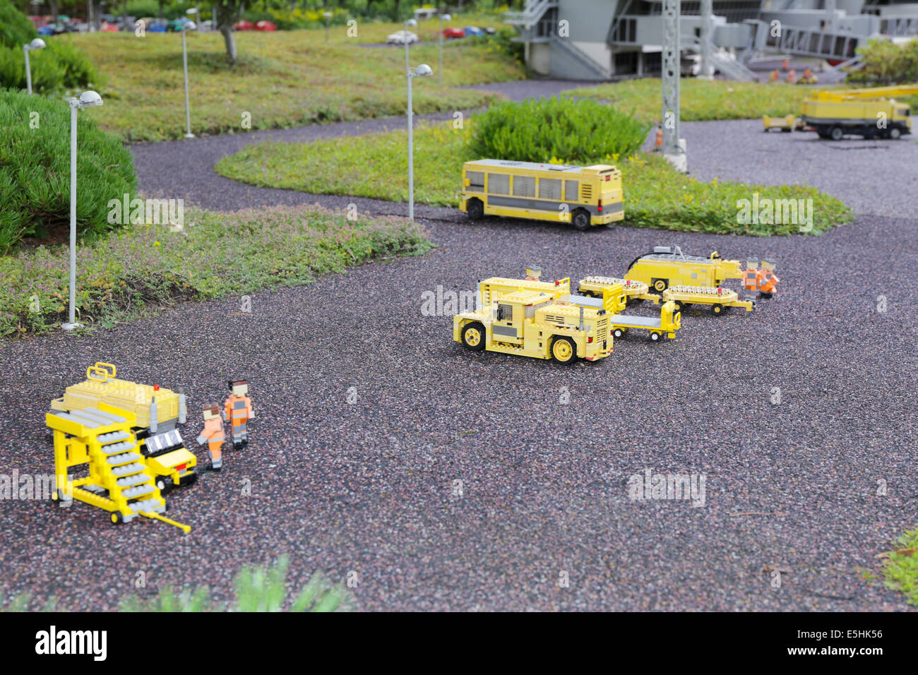 Airport service vehicles and staff waiting outside Stock Photo - Alamy