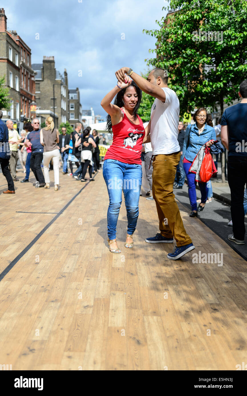 A couple dancing on a wooden dancefloor in public at the Marylebone ...